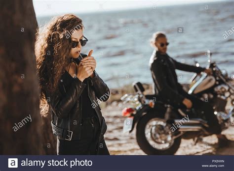 Selective Focus Of Girl Smoking While Her Boyfriend Sitting On