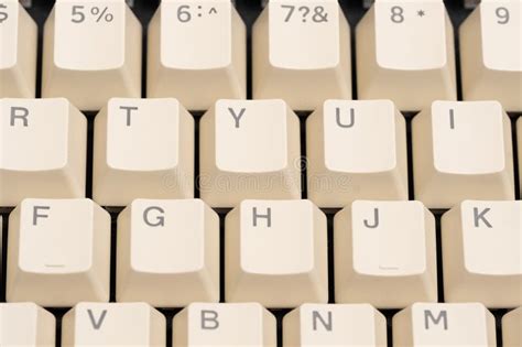 Keyboard Keys Are Beige In Color With English Alphabet Closeup Stock