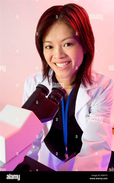 Researcher Microbiologist Or Pathologist Uses A Light Microscope Stock