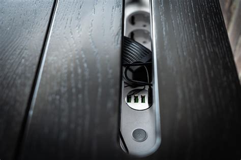 Premium Photo Usb Wire Of Smart Phone Plug In The Usb Charger Socket Built In On The Table