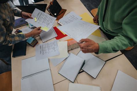 Students Collaborating On Assignments In A Classroom Setting Stock