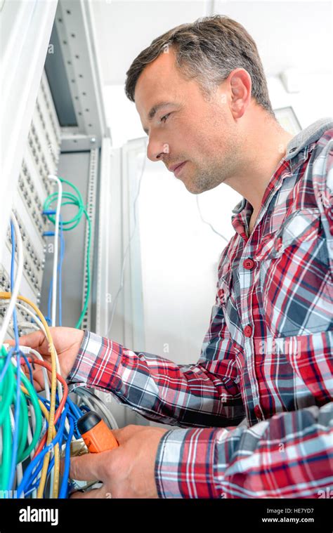 Man Connecting Wires Stock Photo Alamy