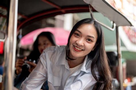 A Beautiful Asian Female Tourist Enjoying A Ride In A Tuk Tuk In