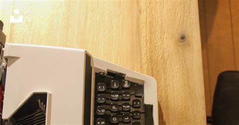 Black And Silver Computer Keyboard On Brown Wooden Desk Photo Free Groningen Image On Unsplash