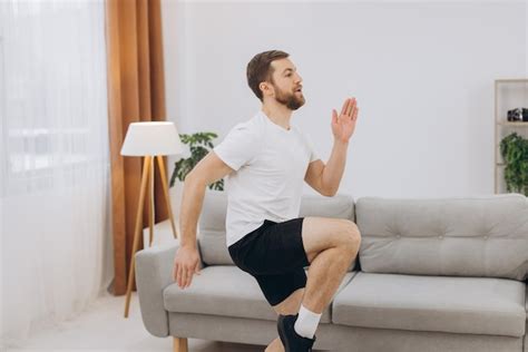 Premium Photo Handsome Bearded Man Doing Hamstring Stretch Exercise