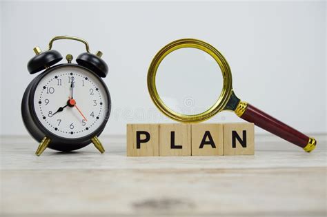 Time To Plan With Wooden Blocks Alphabet Letters And Magnifying Glass On Wooden Background Stock