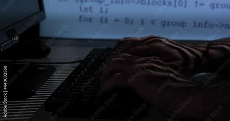 Hacker Or Coder Types Code On A Computer Keyboard In A Close Up Stock