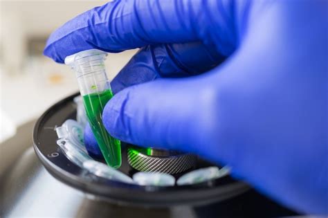 Premium Photo Scientist Loading A Sample To Centrifuge Concept