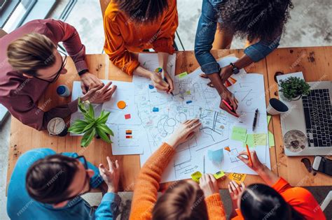 Premium Photo Office Teamwork During A Brainstorming Session Collaborative Synergy In An