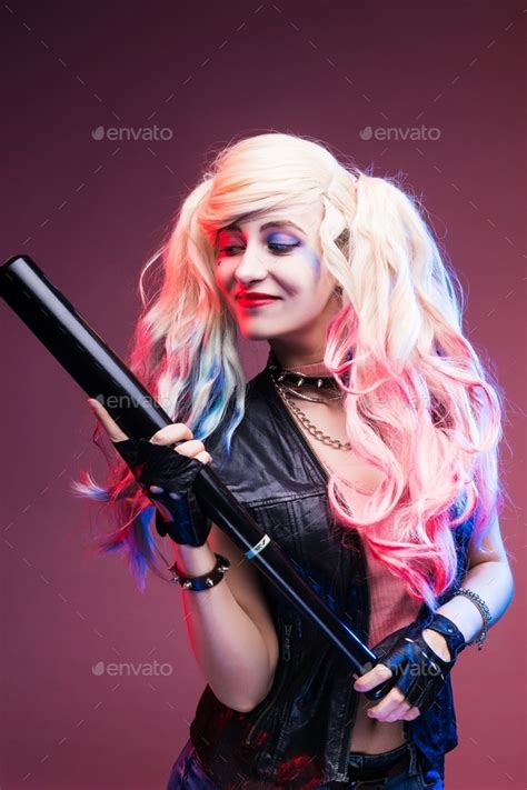 Cosplayer Girl With A Baseball Bat In A Harley Quinn Costume Stock