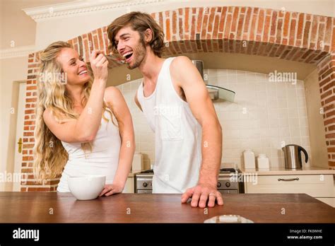 Pretty Woman Feeding Her Boyfriend Stock Photo Alamy