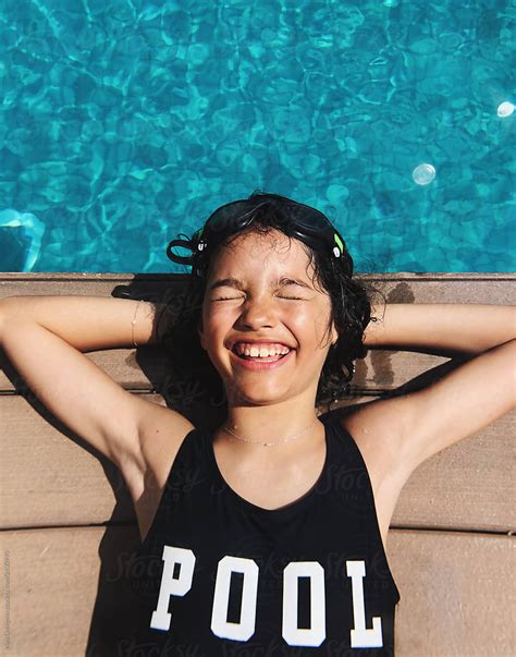 Happy Girl In A Pool By Stocksy Contributor Irina Ozhigova Stocksy