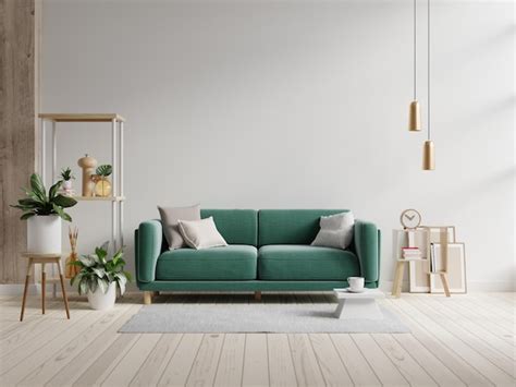 거실 내부 벽은 녹색 소파와 흰색 벽에 식물을 조롱합니다 프리미엄 사진