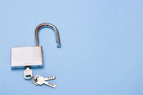 Premium Photo Open Padlock Padlock With Keys On Blue Background With