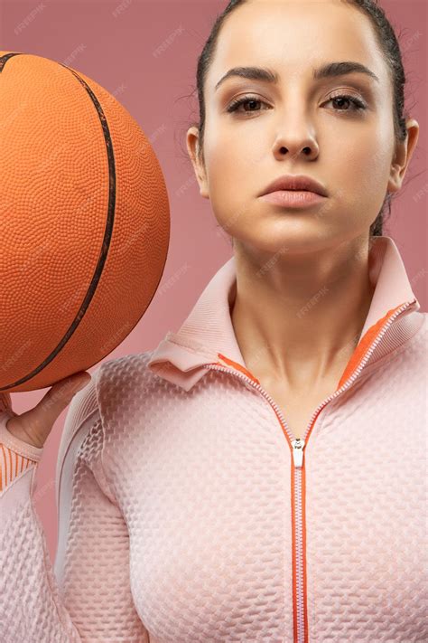 Premium Photo Beautiful Young Woman Holding Orange Basketball Ball