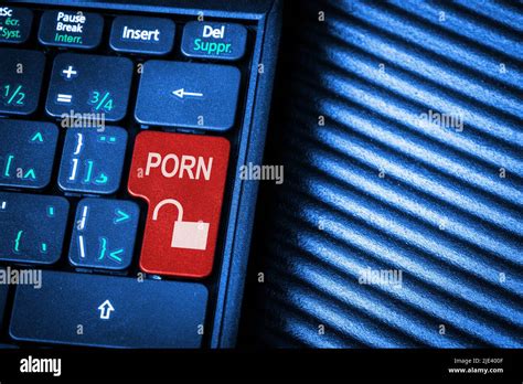 Surfing The Internet Unlocking Pornography Concept Showing Red Computer Key Marked Porn With