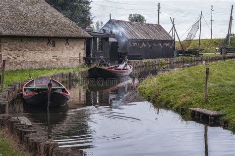 Small Canal With Its Traditional Fishing Boats Fish Smoker In The