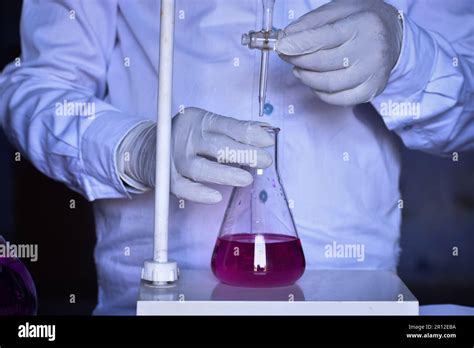 The Scientist Is Conducting An Acid Base Titration In The Lab Measuring Precisely The Amount Of