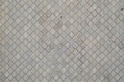 Premium Photo The Texture Of A Rhythmic Mosaic Made Of Concrete Tiles