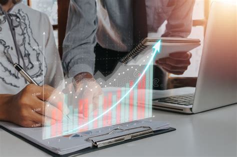 business team using laptop analyzing sales data and economic growth