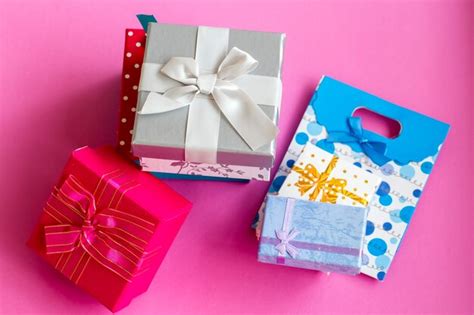 Premium Photo Colorful T Surprise Packages On Pink Background
