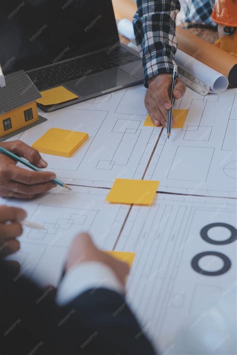 Premium Photo Engineer Teamwork Meeting Drawing Working On Blueprint