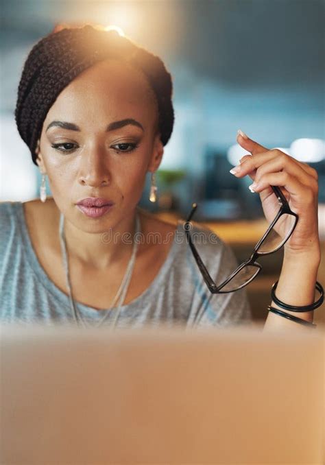 Shes Committed To Her Work A Young Woman Using Her Laptop While