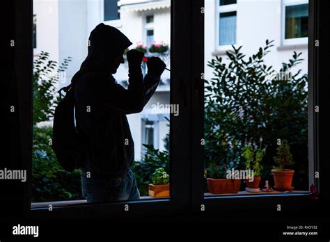 Burglar Prying Open A Window With A Screwdriver Broad Daylight Stock Photo Alamy Burglar Prying Open A Window With A Screwdriver Broad Daylight Stock Photo Alamy