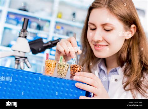 Model Released Female Lab Technician Testing Legumes In The Laboratory