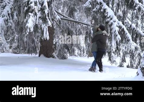 Young Loving Couple Screwing In The Open Air Walking In Winter Park