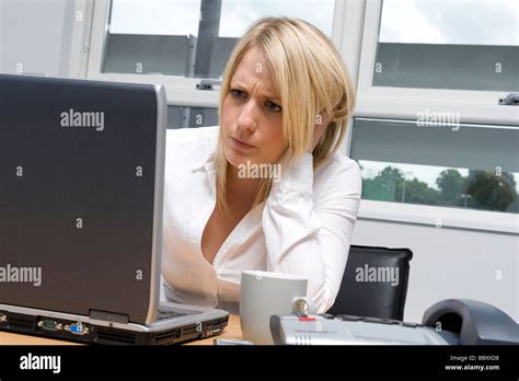 Female Office Worker Using Laptop Computer Stock Photo Alamy