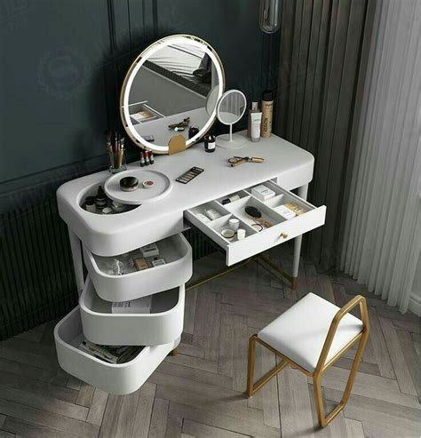 White Vanity Table With Multiple Slider Drawer A Chair And Round Mirror