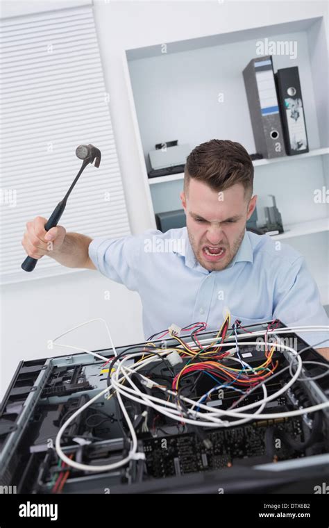 Frustrated Man Hitting Cpu With Hammer Stock Photo Alamy
