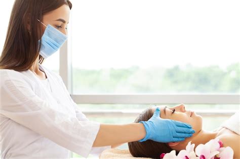Premium Photo Beautiful Young Woman Relaxing With Hand Massage At Beauty Spa Salon