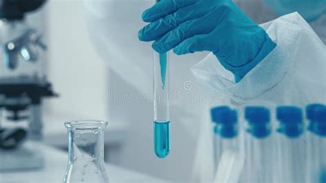 The Piped Draws The Solution Into The Test Tube With A Dispenser Video Depicts Daily Workflow