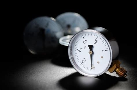 Premium Photo Manometer On The Black Grained Surface