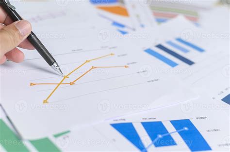 Top View Of Documents With Analytics Data Lying On Tableselective