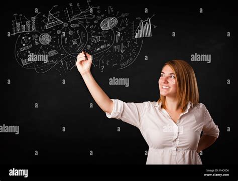Pretty Girl Sketching Graphs And Diagrams On Wall Stock Photo Alamy
