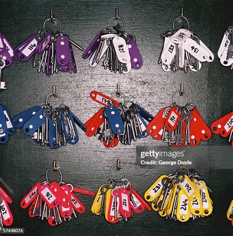 closeup of an array of keys hung at a hotel reception high res stock