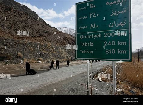 Travelers Approach On Foot The Border Crossing With Turkey At The Razi
