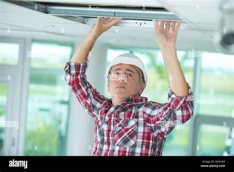 Man Installing Suspended Ceiling Stock Photo Alamy