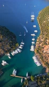 Aerial View Of Coastline With Yachts In Serene Bay Turkey Overhead