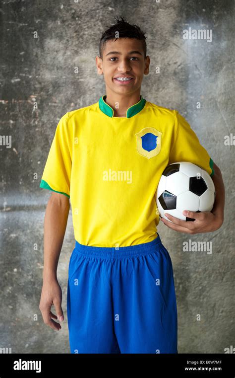 Smiling Young Brazilian Soccer Player In Team Uniform Of Brazil Colors