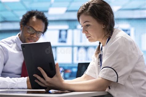 Healthcare Provider Presenting Lab Test Results To A Patient In Cabinet Stock Image Image Of