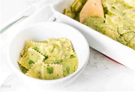 Baked Ravioli With Pesto Creamy Sauce Domestically Speaking