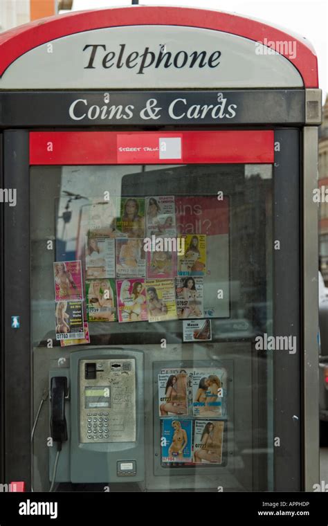 London Phone Box With Cards Offering The Services Of Sex Workers Stock Photo Alamy