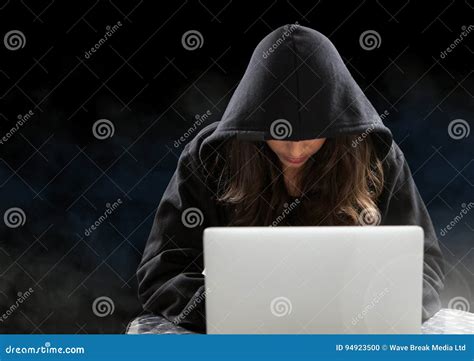 Woman Hacker Working On Laptop In Front Of Black Background Stock Photography CartoonDealer