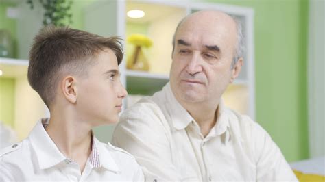 The Old Man And The Boy Look At Each Other Emotional Expression Stock Video At Vecteezy