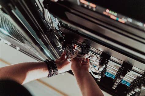 Close Up Of Technician Setting Up Network In Server Room Stock Image