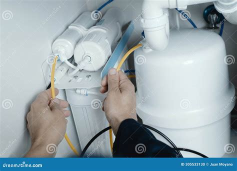 Man Installing A Reverse Osmosis System Stock Photo Image Of Installing Improvement